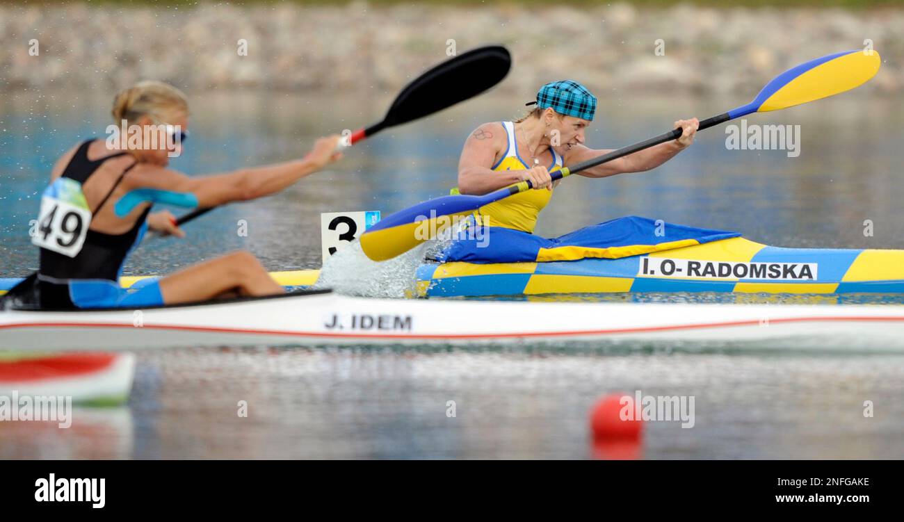 Ukraine's Inna Osypenko-Radomska, right, leads Italy's Josefa Idem ...