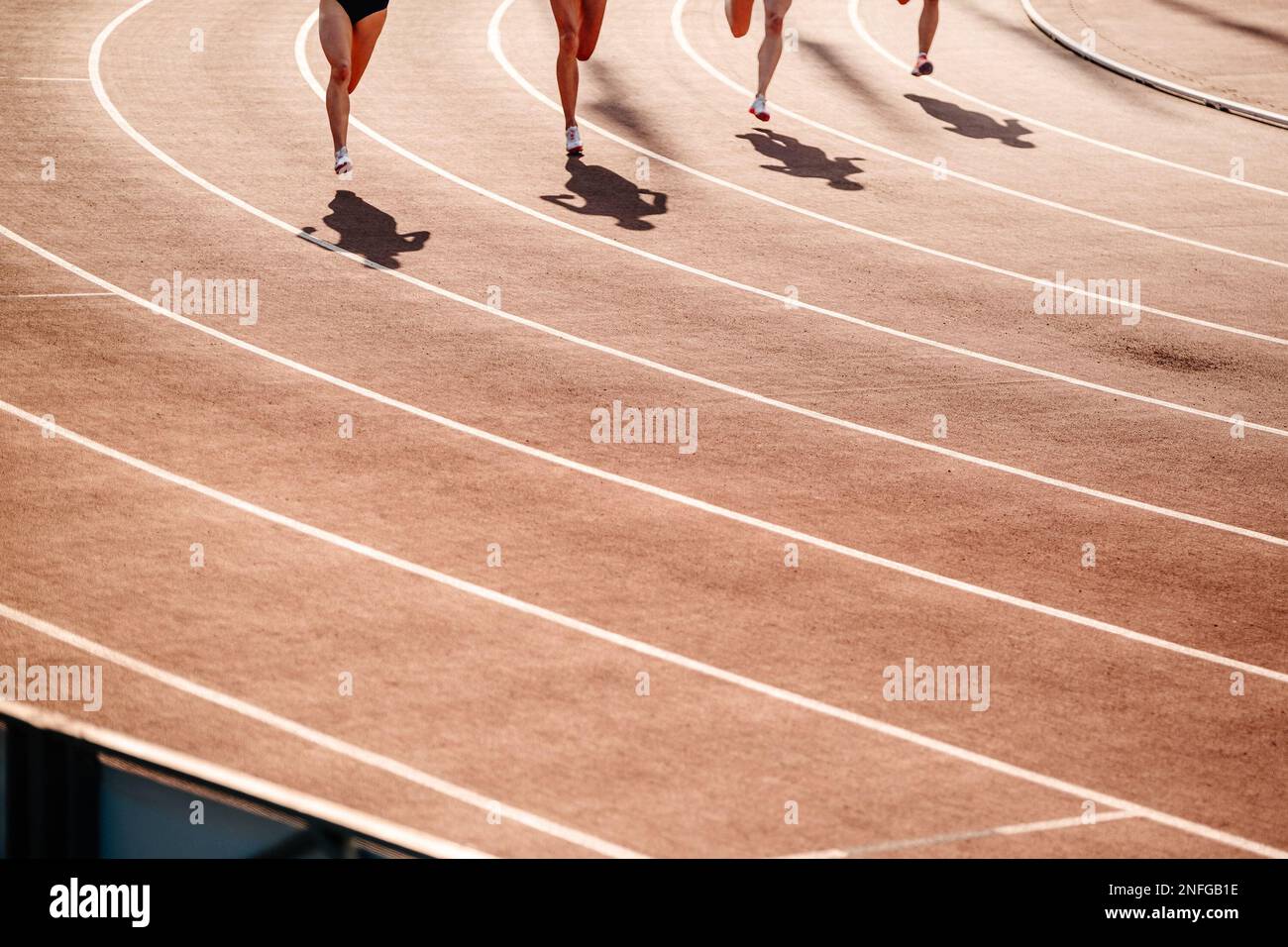 group female athletes running track of stadium Stock Photo - Alamy