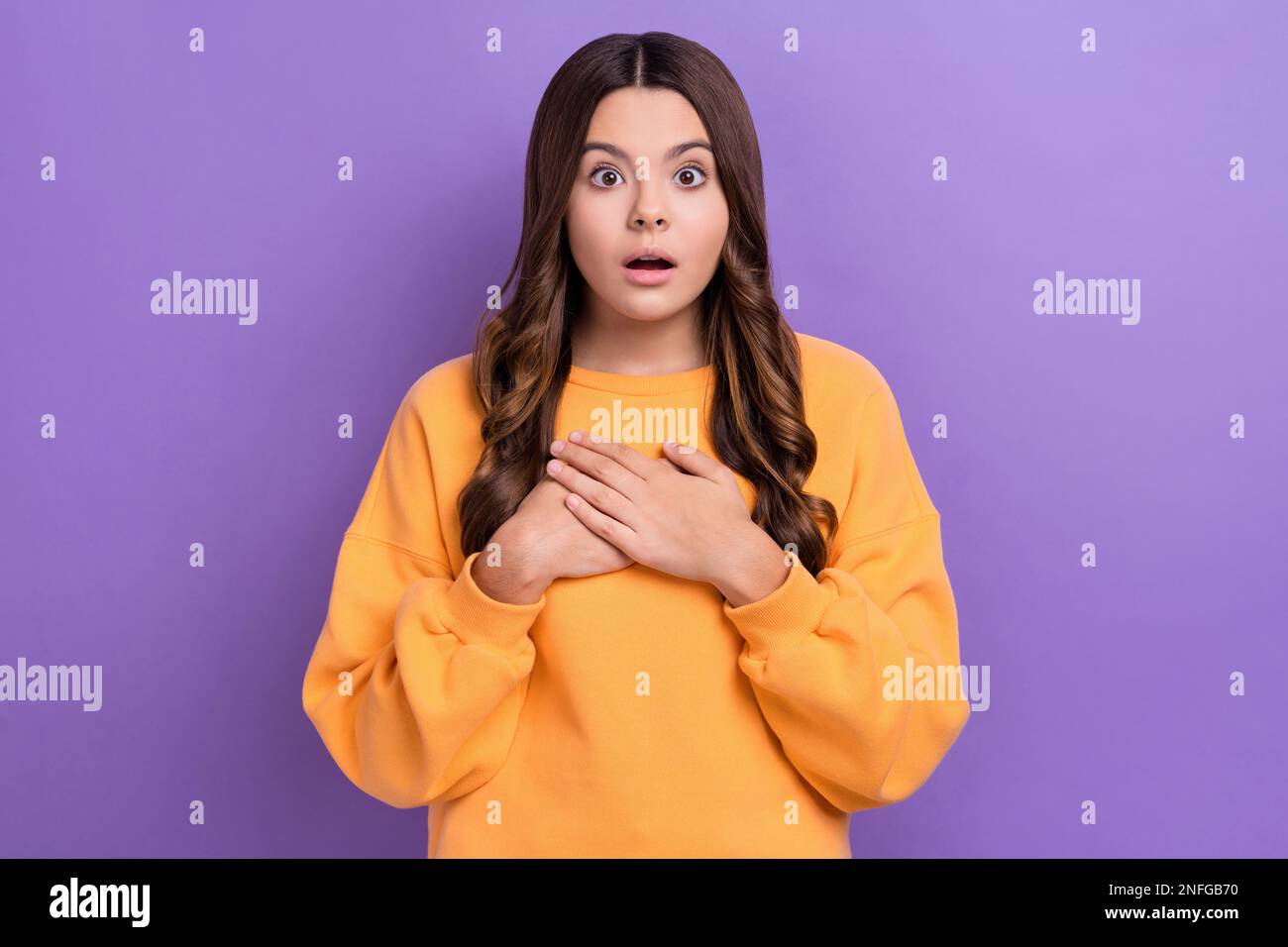 Photo of worried nervous lady wear trendy clothes hand chest omg ...