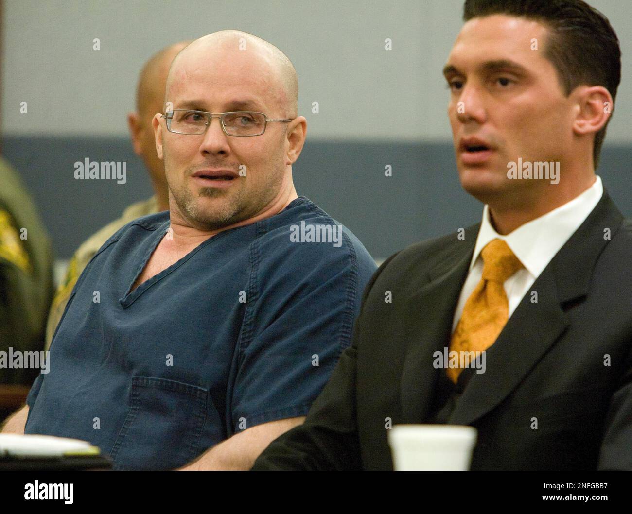 Professional bodybuilder Craig Titus sits with his attorney Marc ...