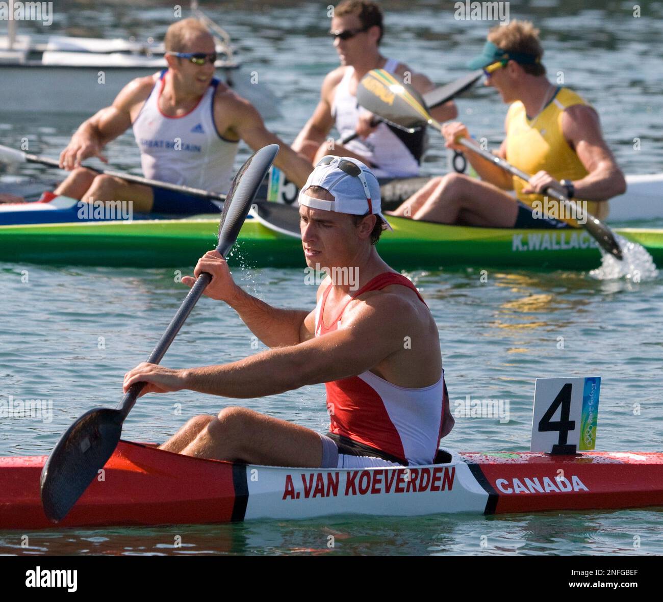 Canada's Adam van Koeverden of Oakville, Ont., centre, paddles past ...