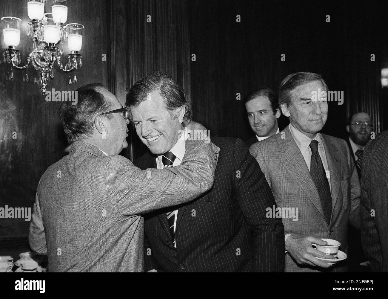 Sen. Russell Long of Louisiana, left, hands whispered conversation with ...