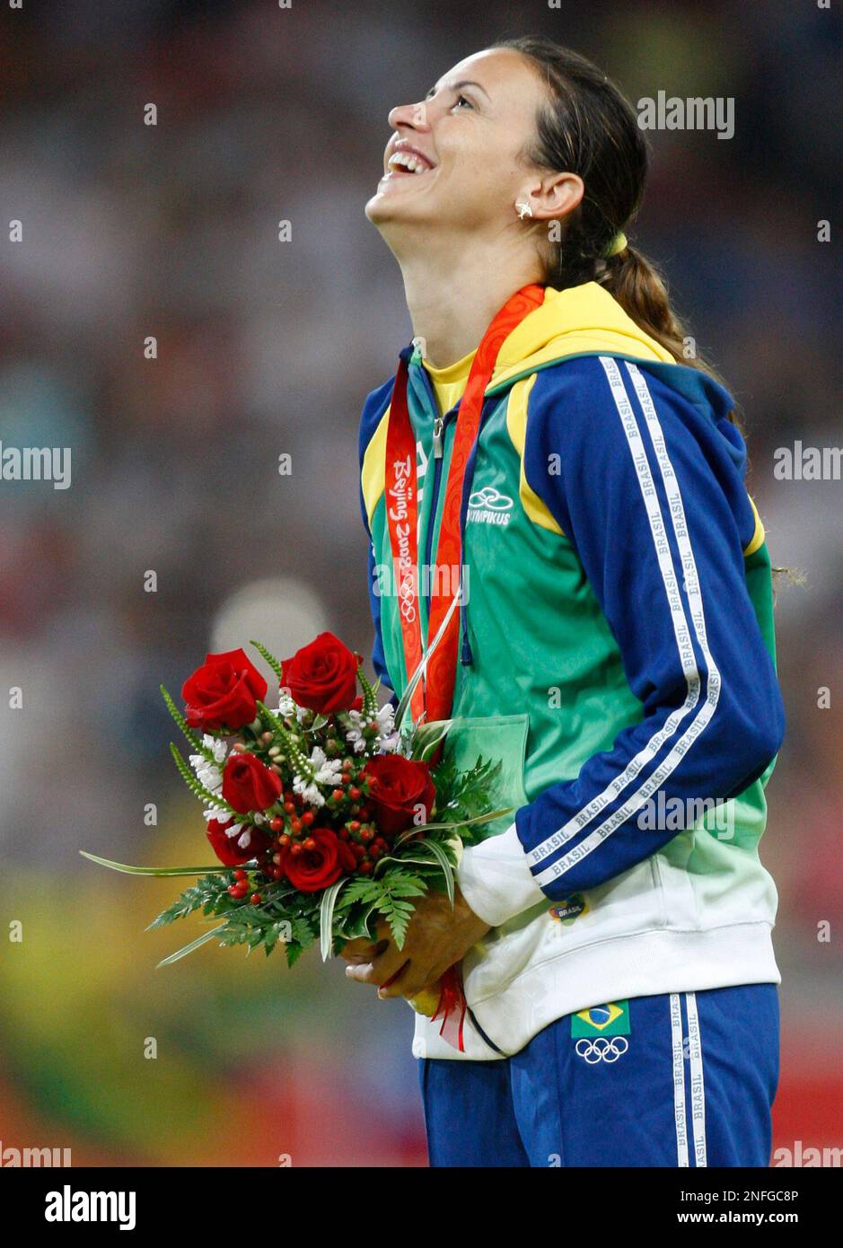 Women's long jump winner Brazil's Maurren Higa Maggi reacts with her ...