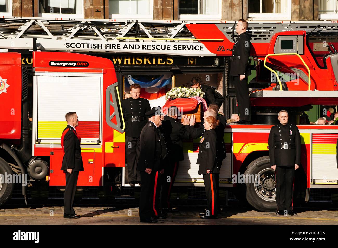 The coffin of Barry Martin is carried into St Giles' Cathedral in ...