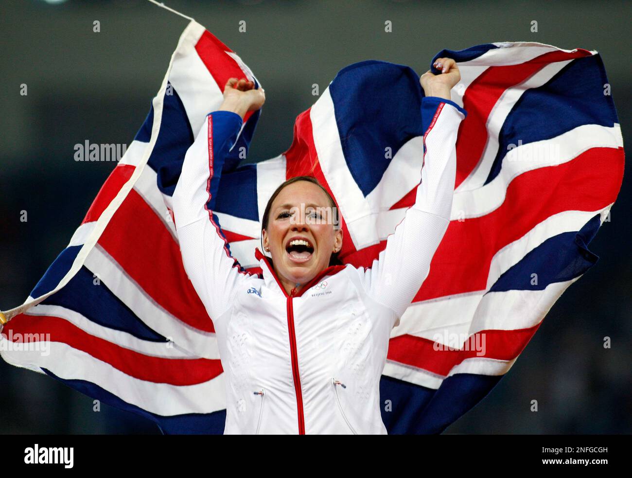 Heather Fell of Great Britain jumps with her flag as she gets up on the ...