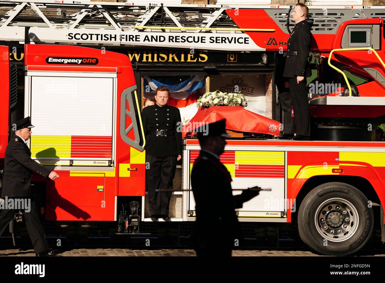 The coffin of Barry Martin arrives on a fire engine outside St Giles ...