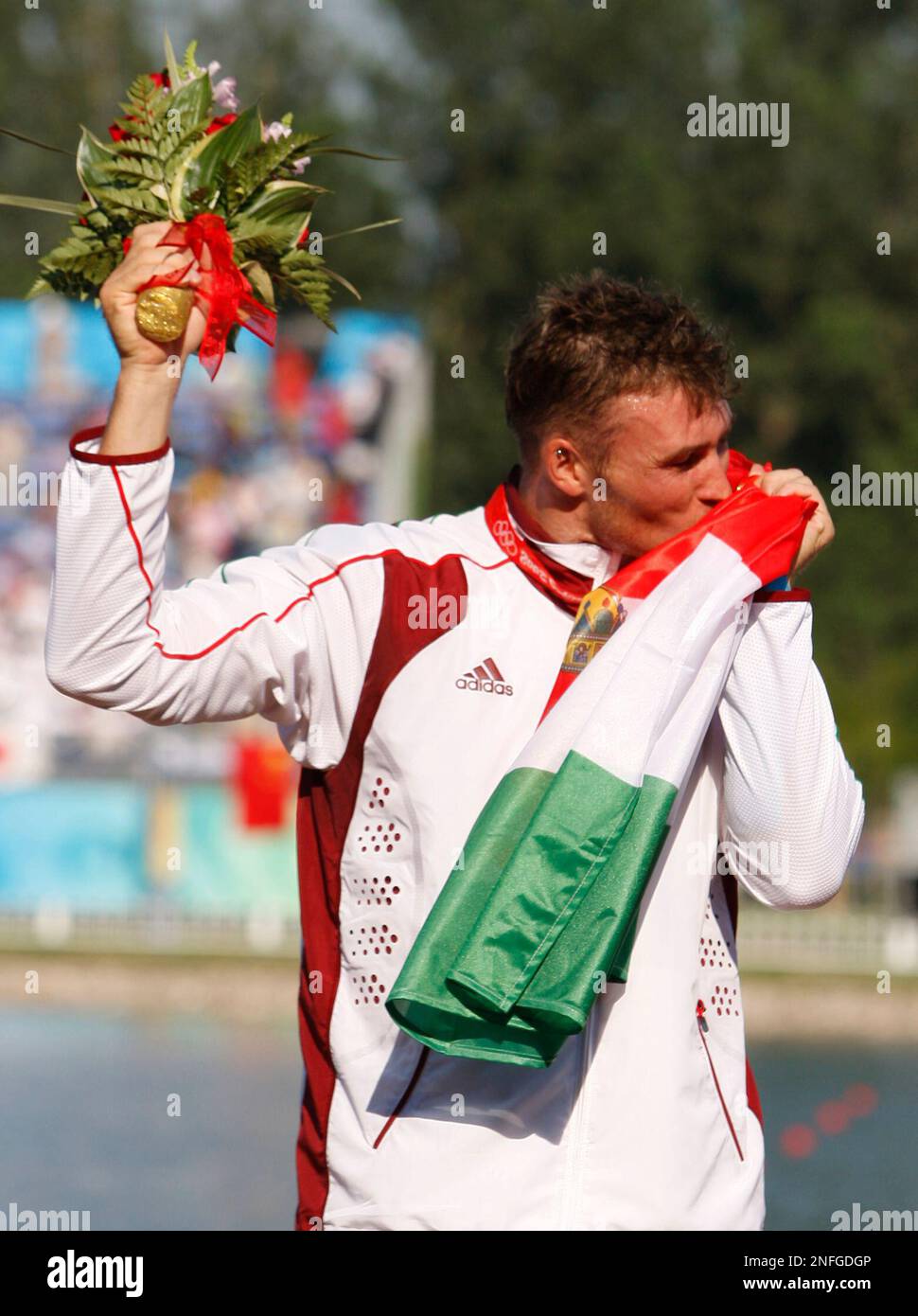 Hungary's Attila Sandor Vajda kisses his national flag on the podium ...