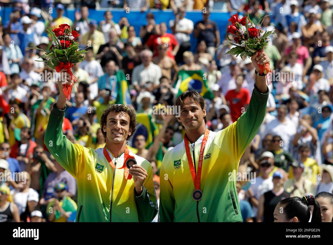 Brazil's Ricardo Santos, right, and Emanuel Rego celebrate winning the ...