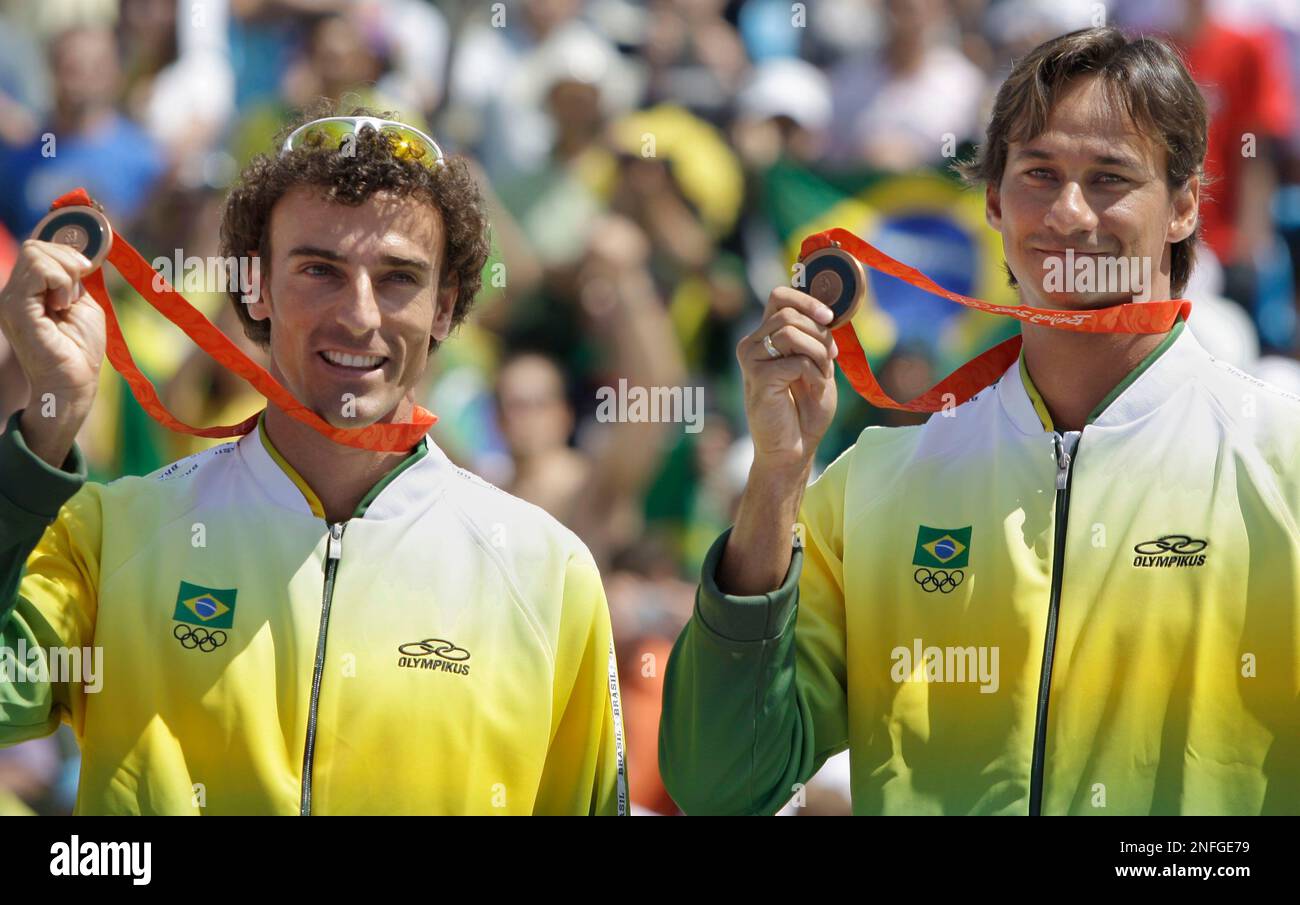 Brazil's Ricardo Santos, right, and Emanuel Rego celebrate winning the ...