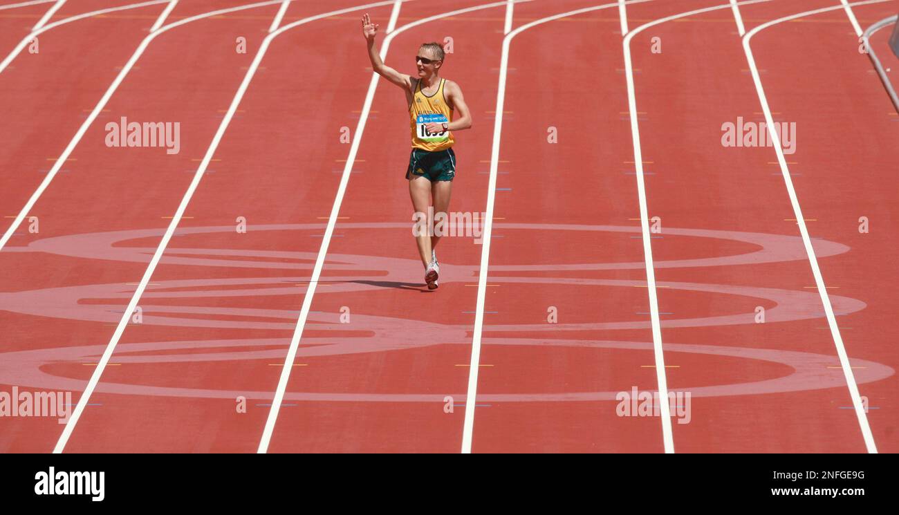 Australia's Jared Tallent waves as he nears the finish line to take the ...