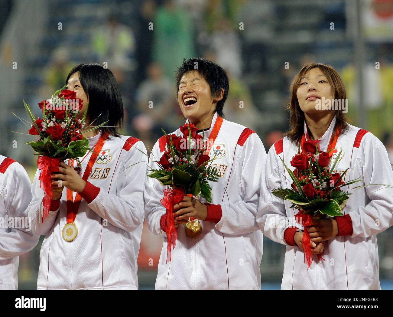 Japan pitcher Yukiko Ueno, center, during the medal ceremony after the ...