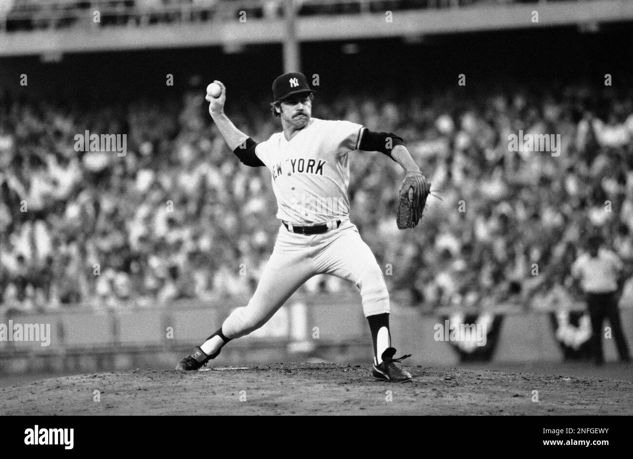New York Yankees pitcher Jim "Catfish" Hunter shows off his form as he ...