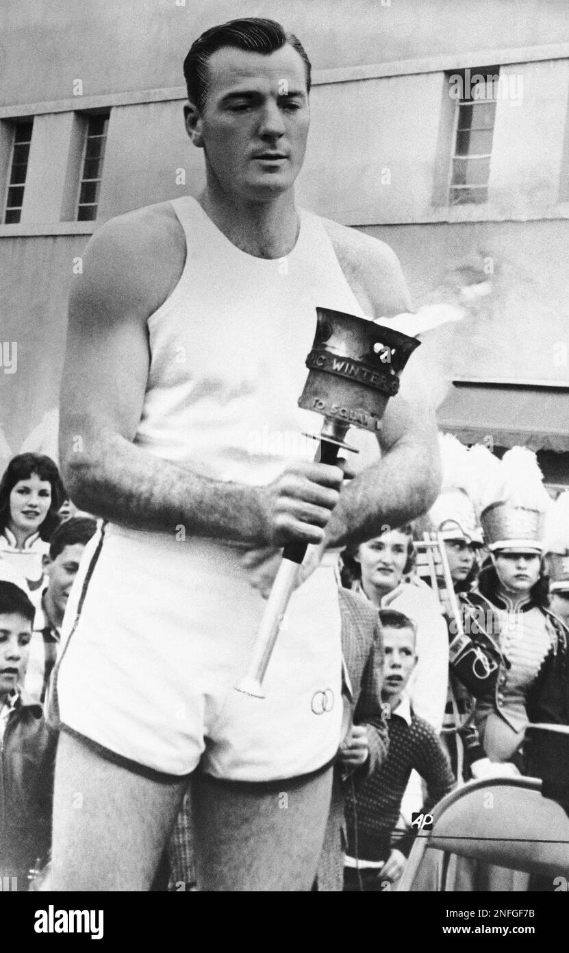 Two-time Olympic decathlon champion Bob Mathias prepares to light ...