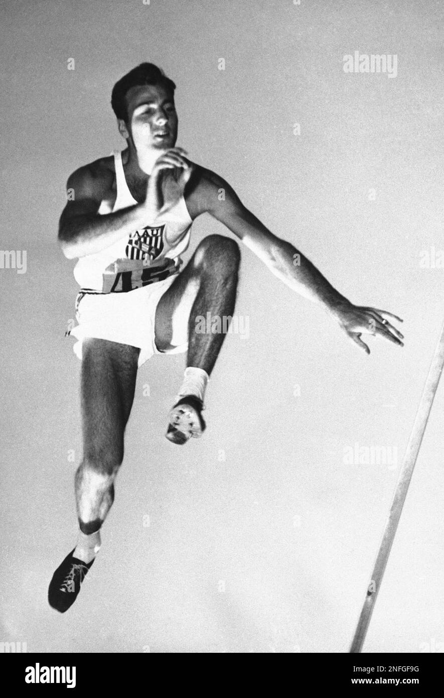 Bob Mathias, world decathlon record holder, takes the high jump at 1.80 ...