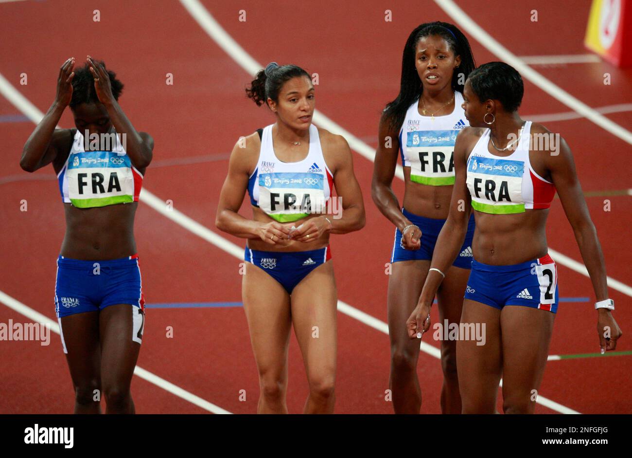 French women's relay team members react after their 4x100-meter relay ...