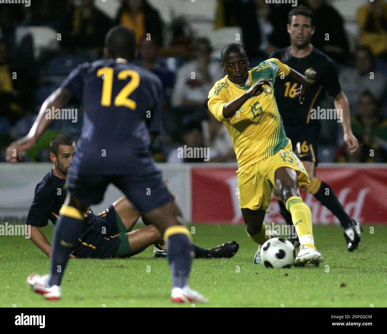 South Africas Sibusiso Zuma Center Controls The Ball As Australias Bruce Djite Left No 12