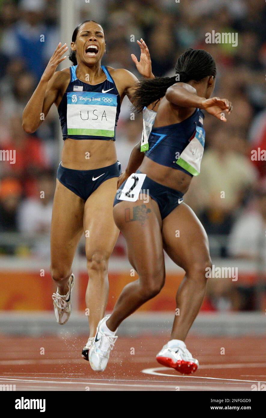 United States' Torri Edwards, left, and Lauryn Williams drop the baton ...