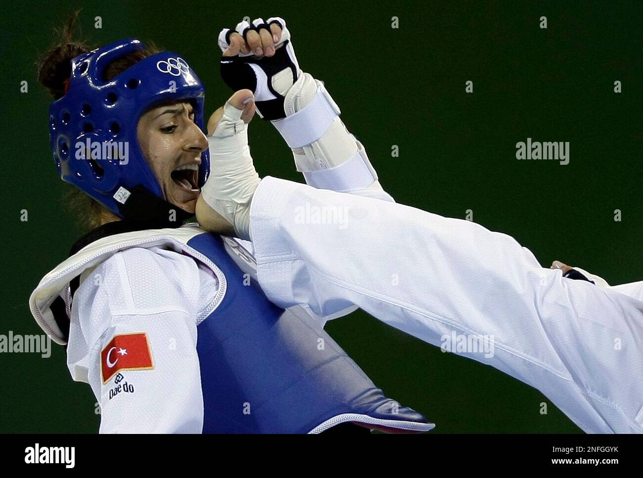 Turkey's Azize Tanrikulu, left, is kicked, by Croatia's Martina Zubcic ...