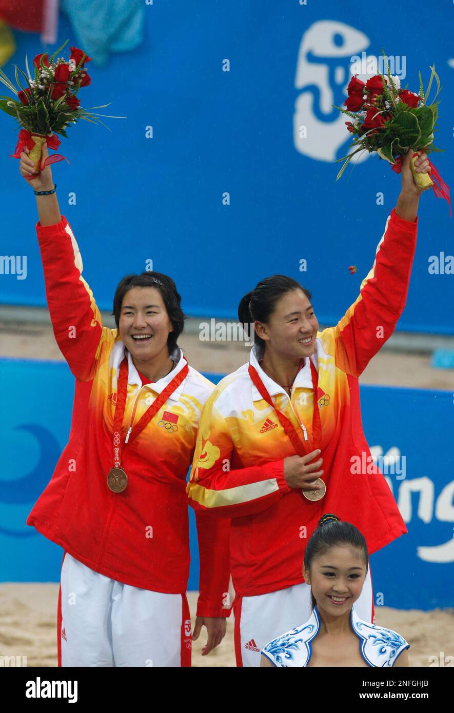 Bronze medalists Zhang Xi, left and Xue Chen, of China, celebrate ...