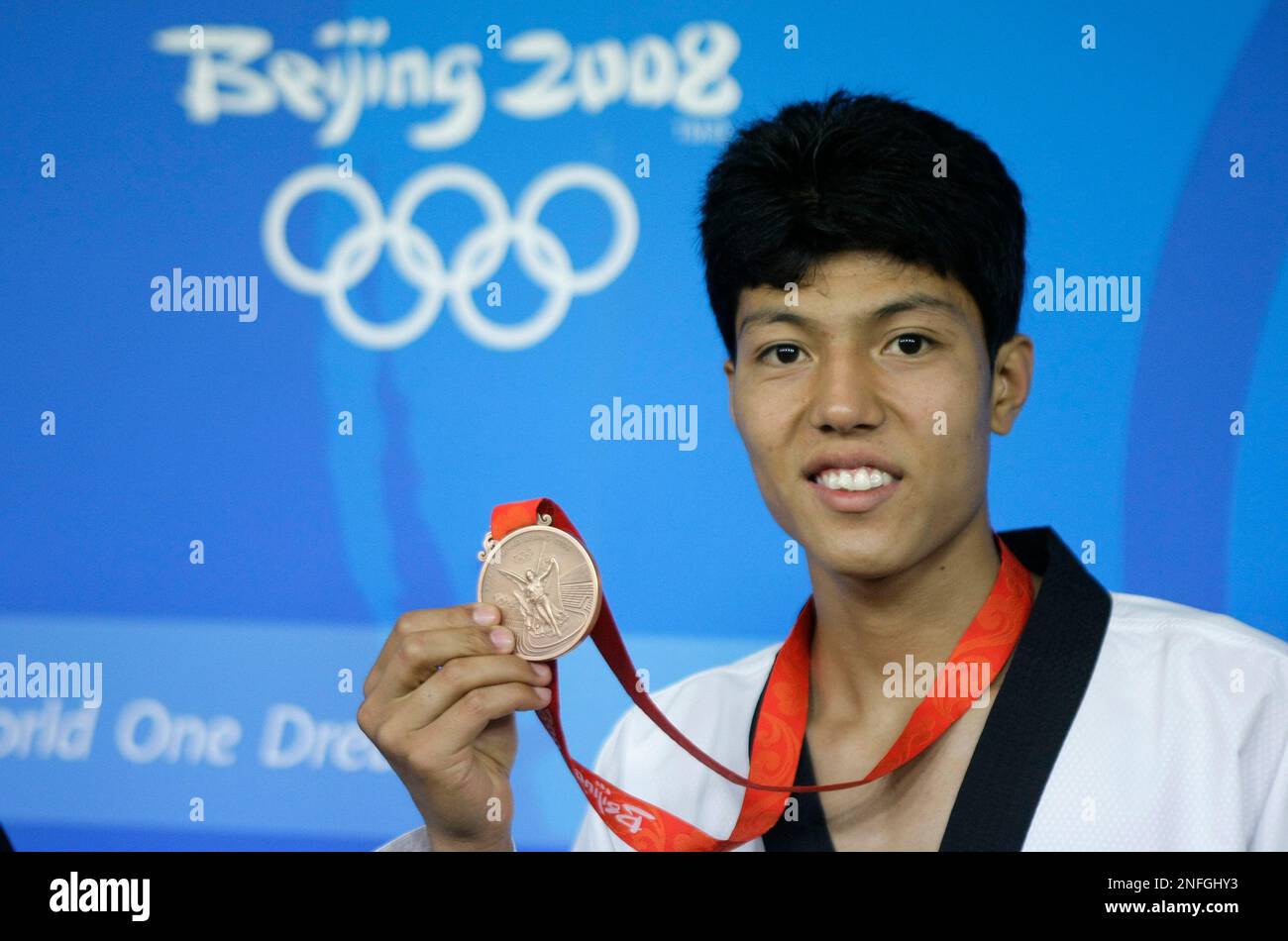 Afghanistan's Rohullah Nikpai poses at a press conference with his ...