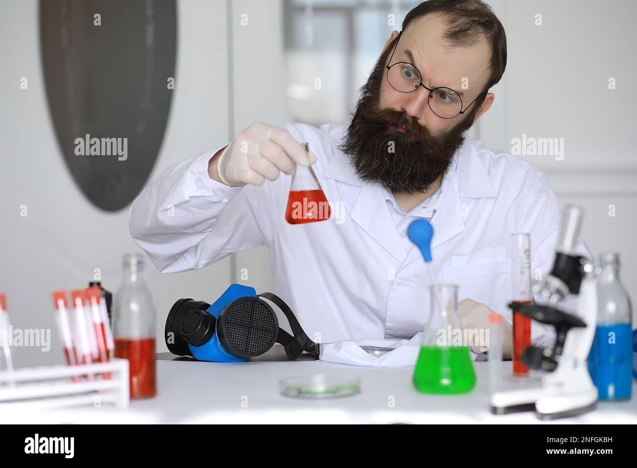 Chemist crazy. A mad scientist conducts experiments in scientific ...
