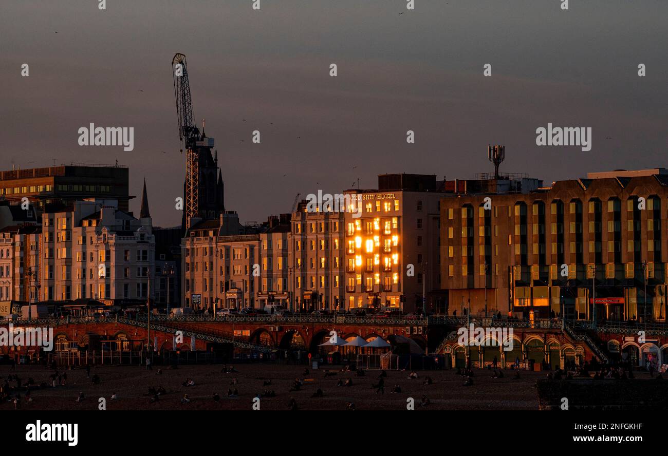 The Old Ship Hotel on Brighton seafront with sun glinting off the ...