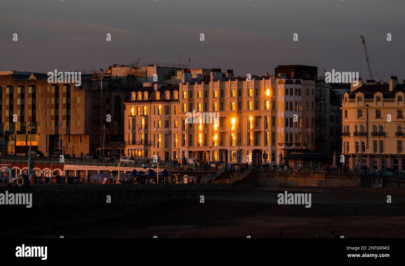 The Queens Hotel on Brighton seafront with sun glinting off the windows ...