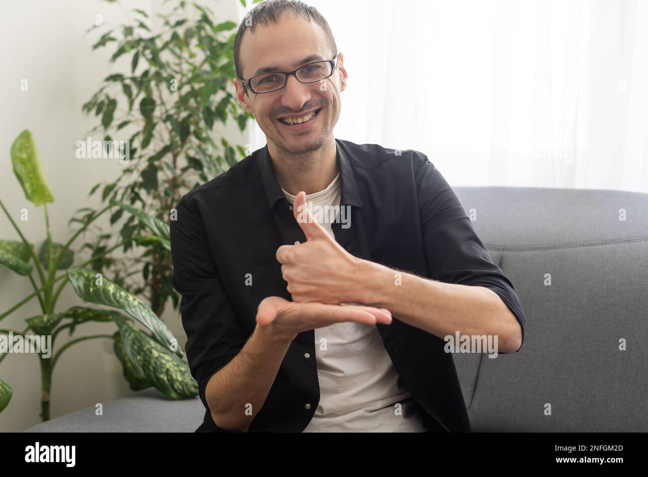 Adult Learning Sign Language For Deaf Disabled Stock Photo - Alamy