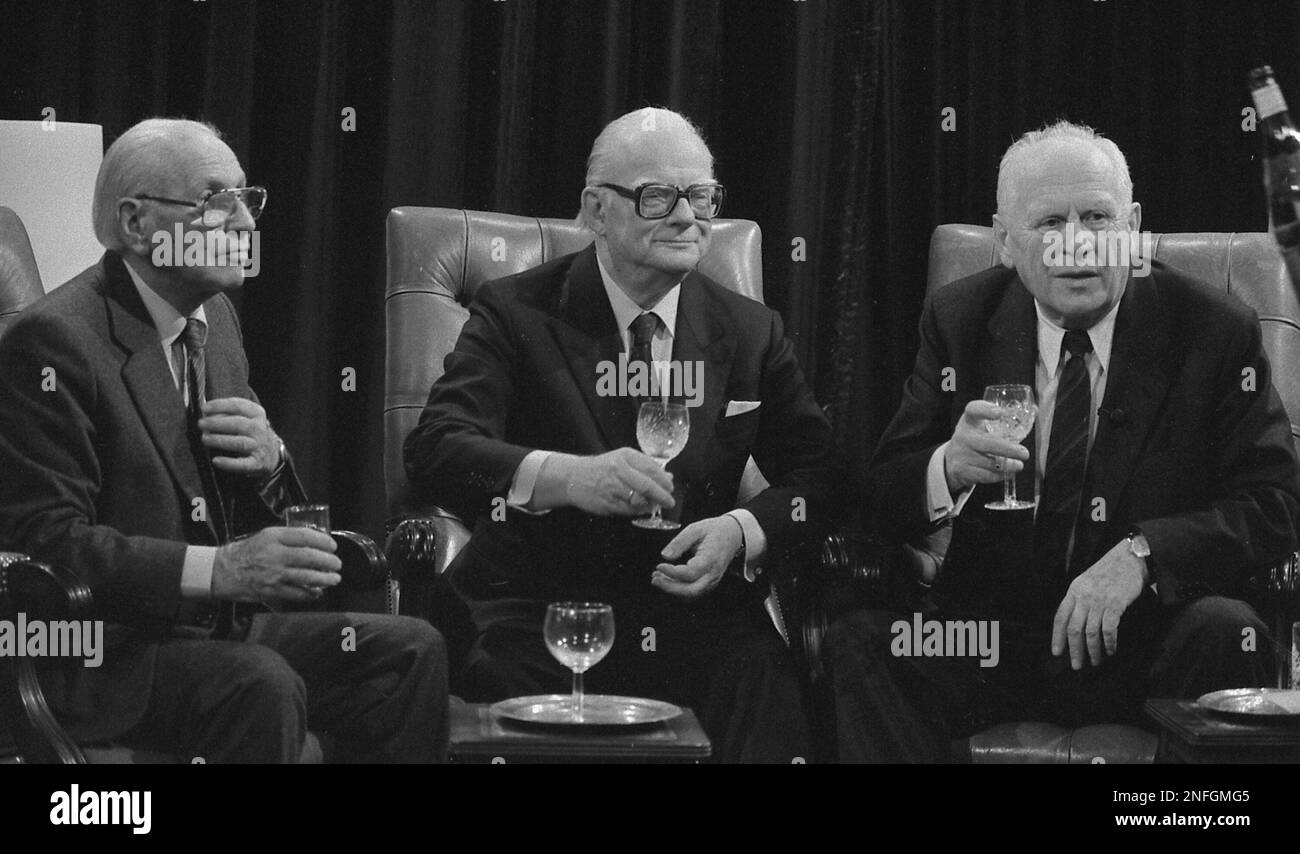 Robert Lembke, Werner Hoefer and Gert Froebe, have a drink during the ...