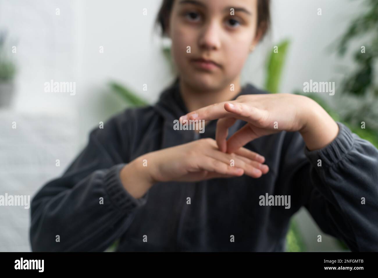 A smiley teenage girl hand sign Stock Photo - Alamy