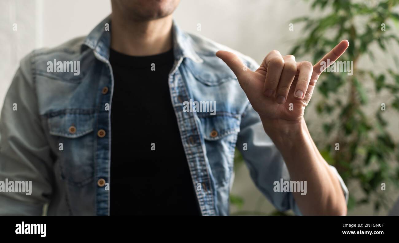 Man showing gesture in sign language on white background Stock Photo ...
