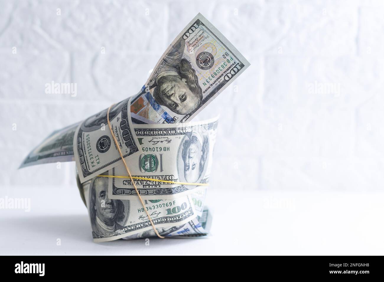 Dollar bills tied rubber band hi-res stock photography and images - Alamy