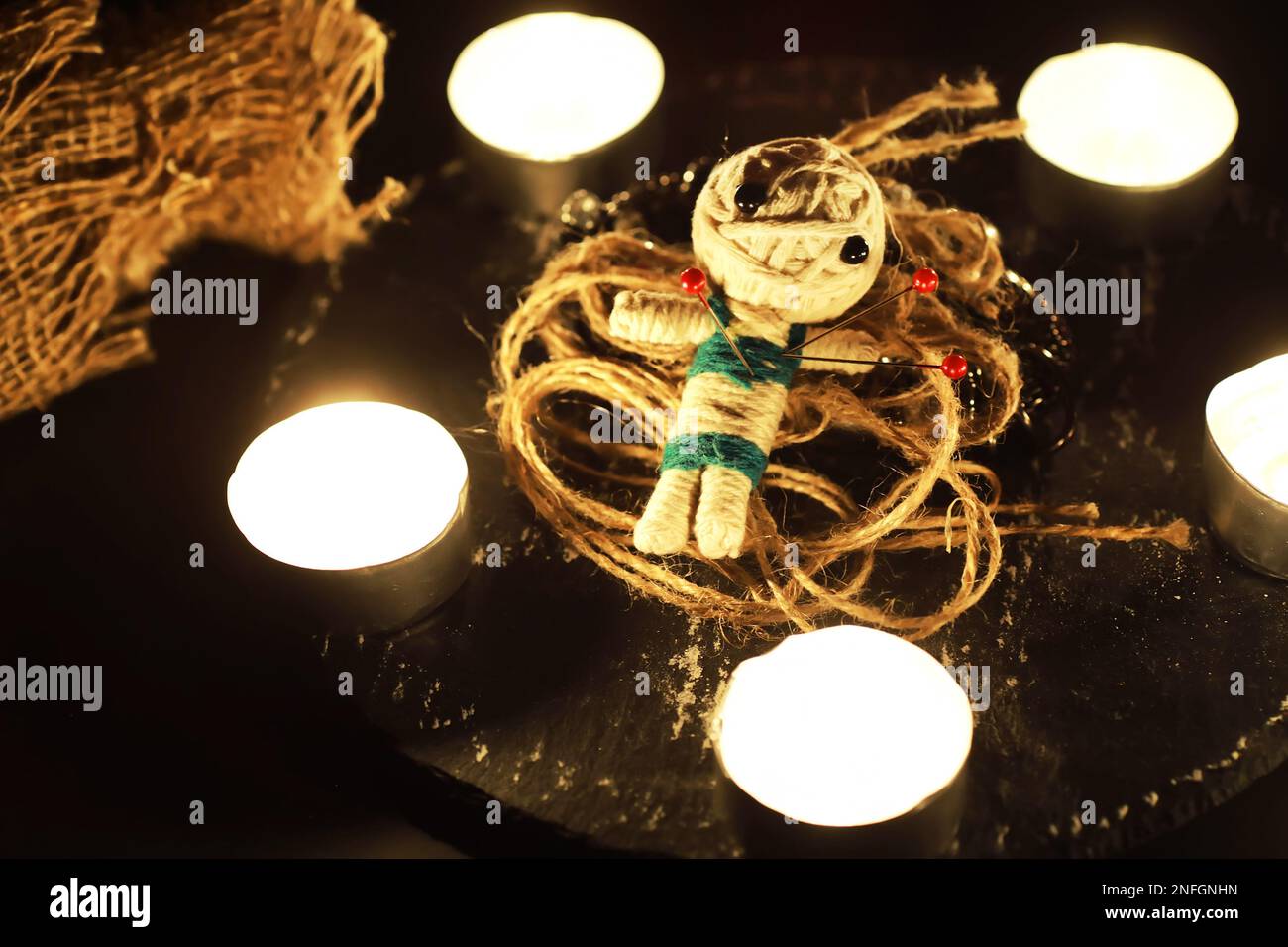 Mystic still life with voodoo doll, the tarot cards, books, evil ...