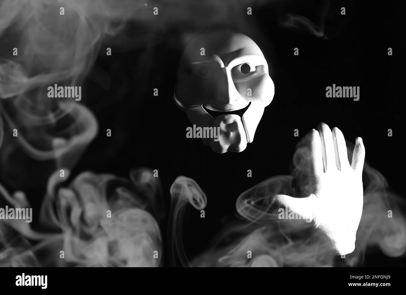 White scary mask on a black background with whites hands Stock Photo ...