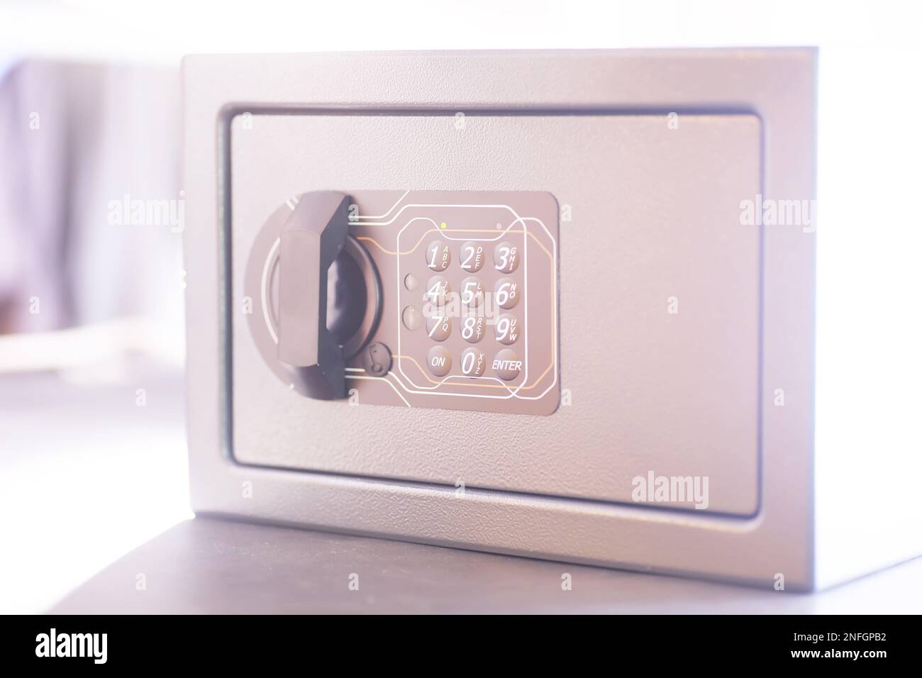 Steel safe with money. Hand putting password in the safety money box in ...