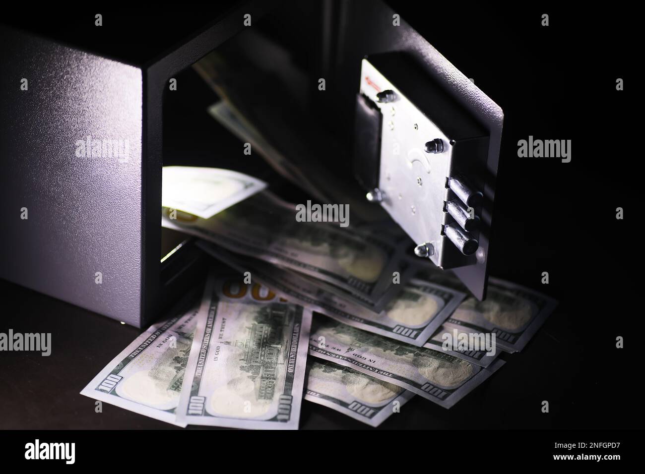 Steel safe with money. Hand putting password in the safety money box in ...