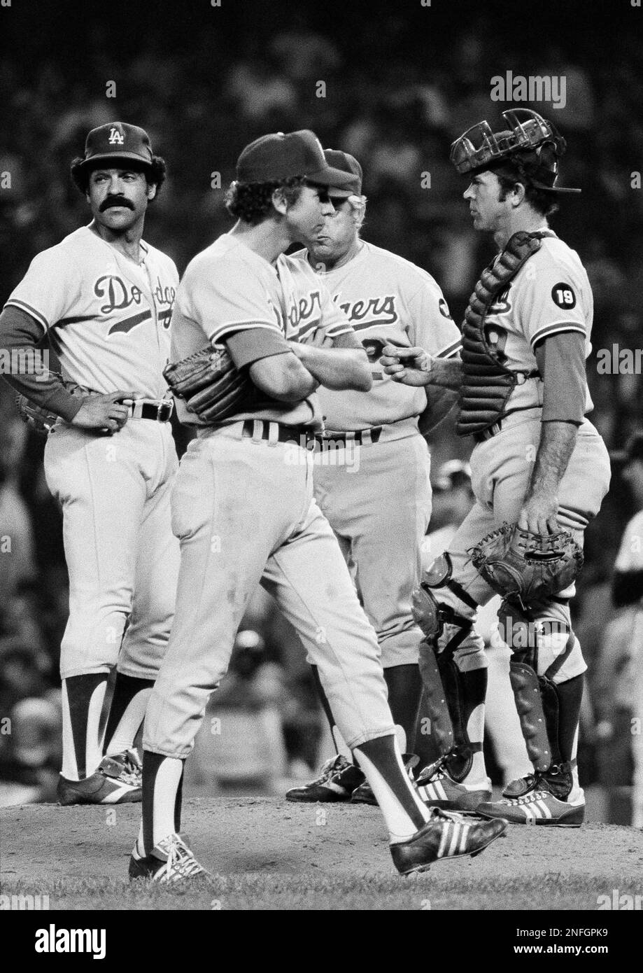 Los Angeles Dodgers pitcher Don Sutton folds his arms as he walks off ...