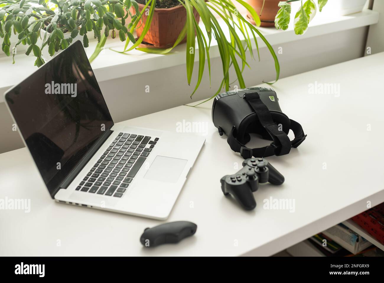 VR glasses and laptop on a table Stock Photo - Alamy