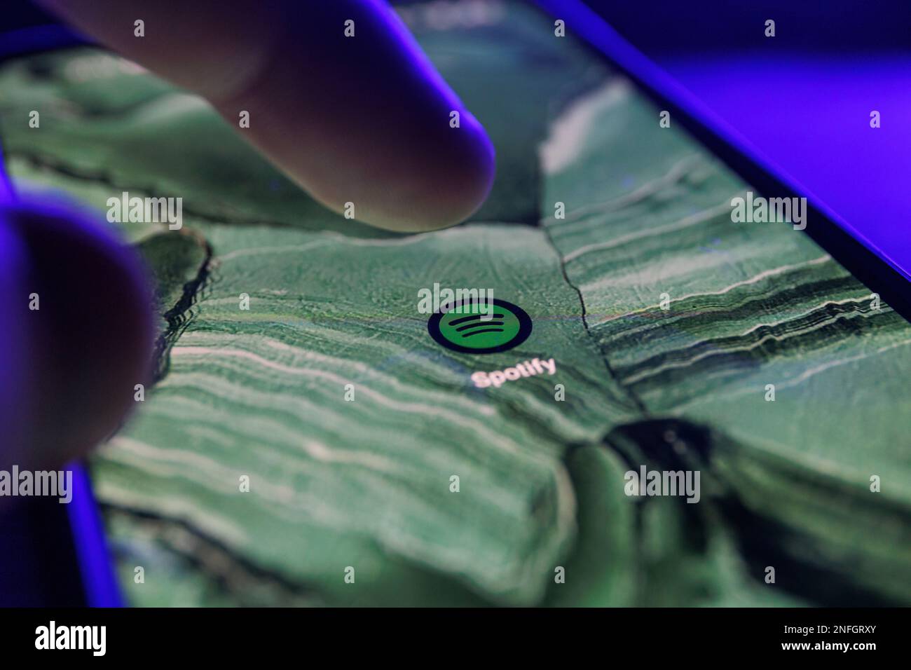Spotify music app on smartphone screen. Close up shot of Spotify music ...