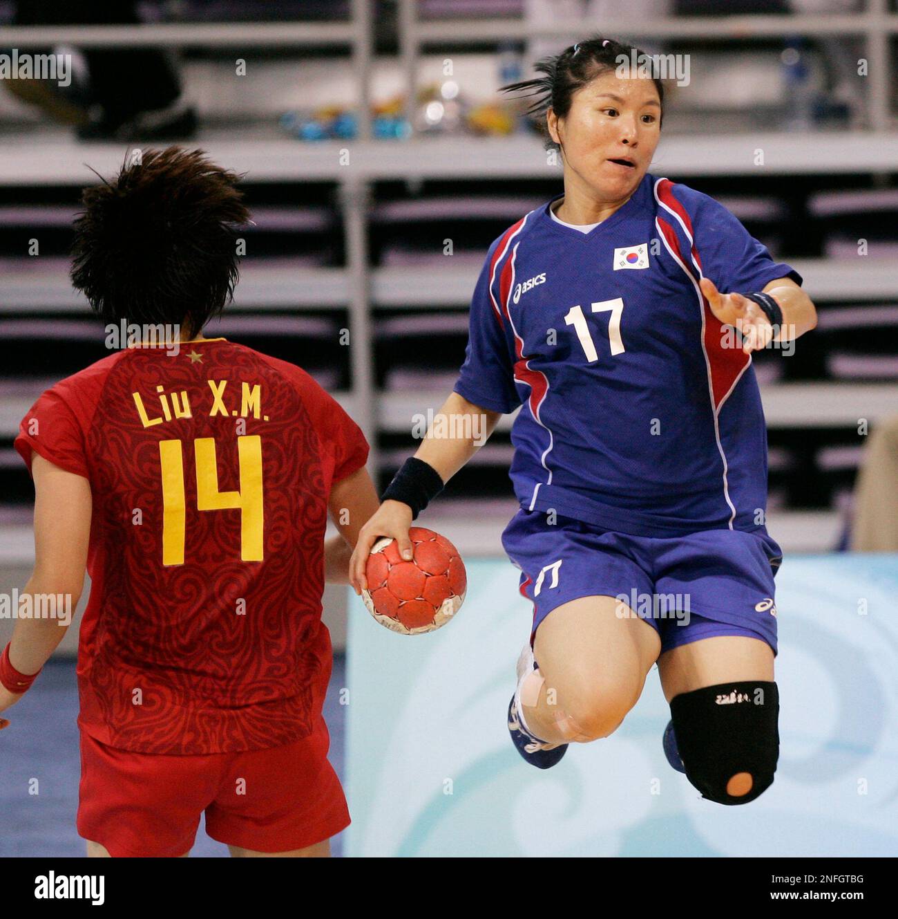 South Korea's An Jung-hwa (17) manages to slip past China's Liu Xiaomei ...