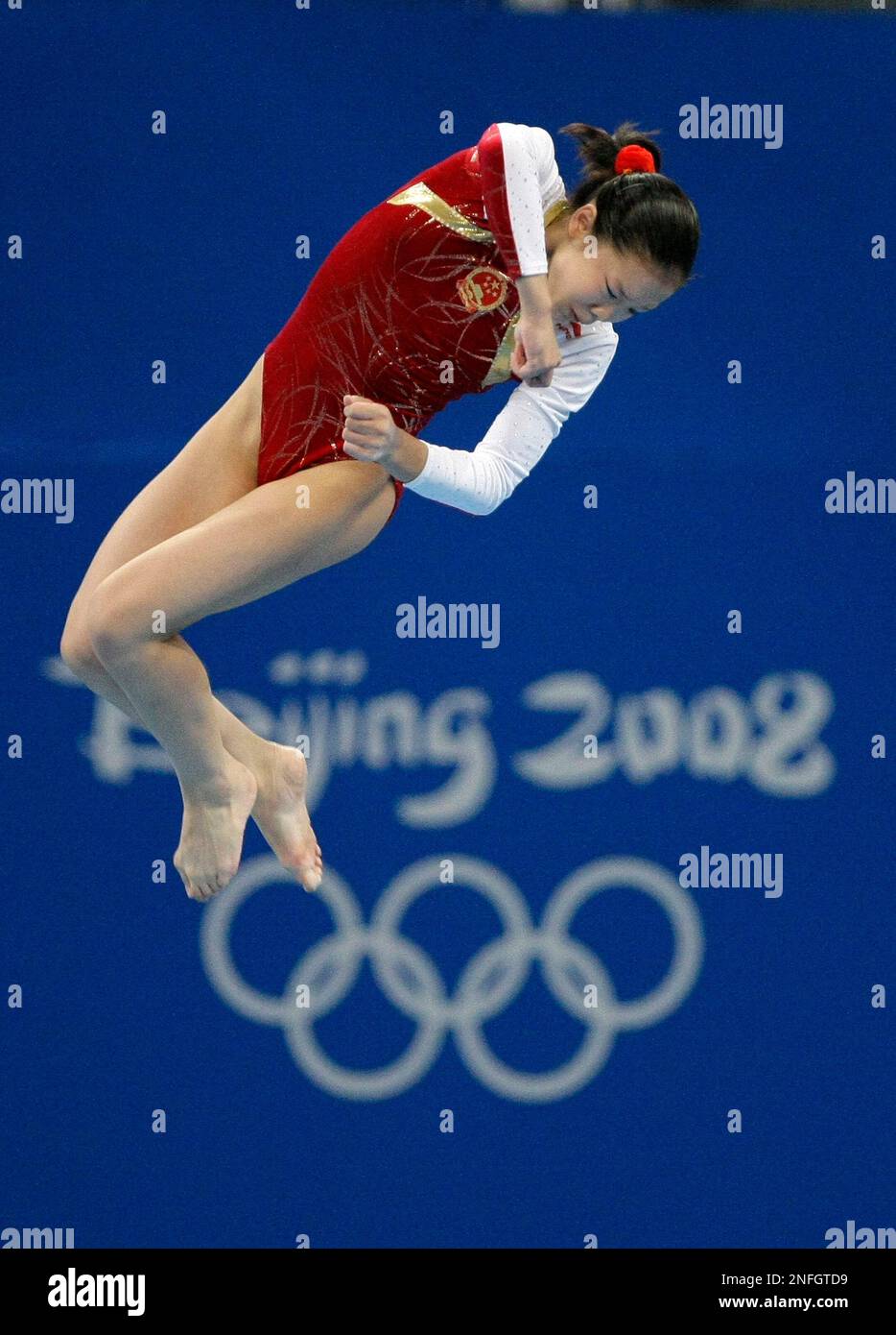 China's gymnast Cheng Fei performs on the balance beam during the ...