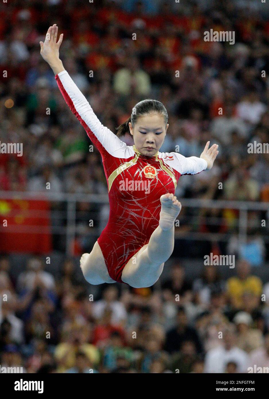 China's gymnast Cheng Fei performs on the balance beam during the women ...