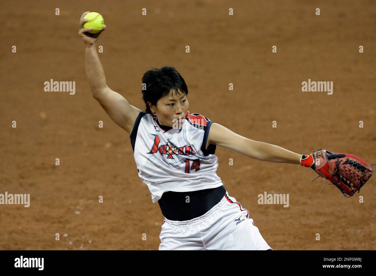 Japan relief pitcher Mika Someya throws against Canada in a softball ...