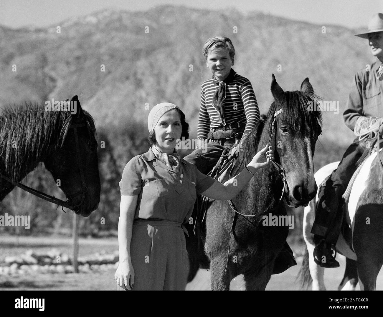Jackie Cooper, young screen player, and his mother are shown, Jan. 31 ...