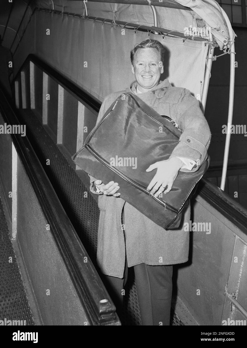 Actor Van Johnson starts up the gang plank of the Liner Liberte, which ...
