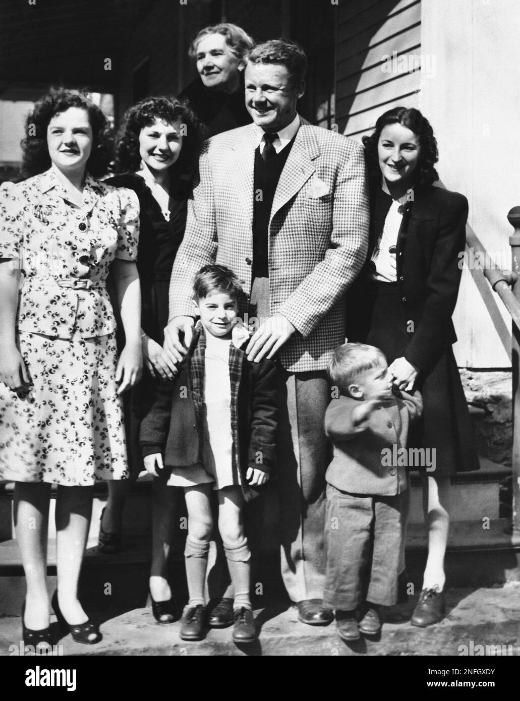 Actor Van Johnson, center, shown surrounded by friends and family ...