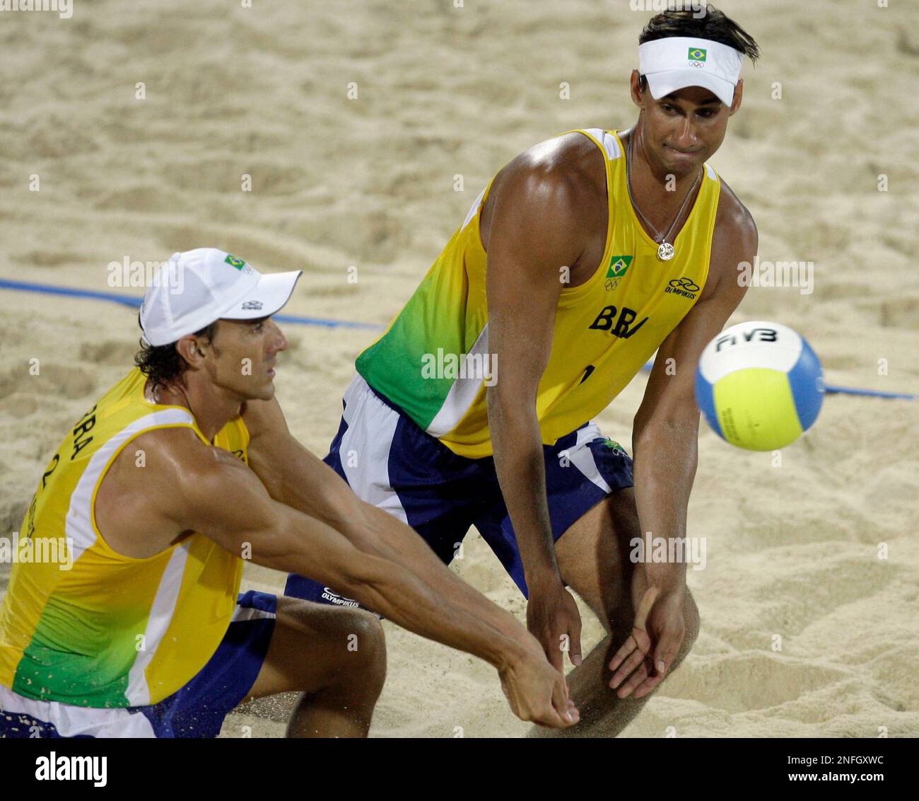 Brazil's Emanuel Rego, left, and Ricardo Santos compete with USA during ...