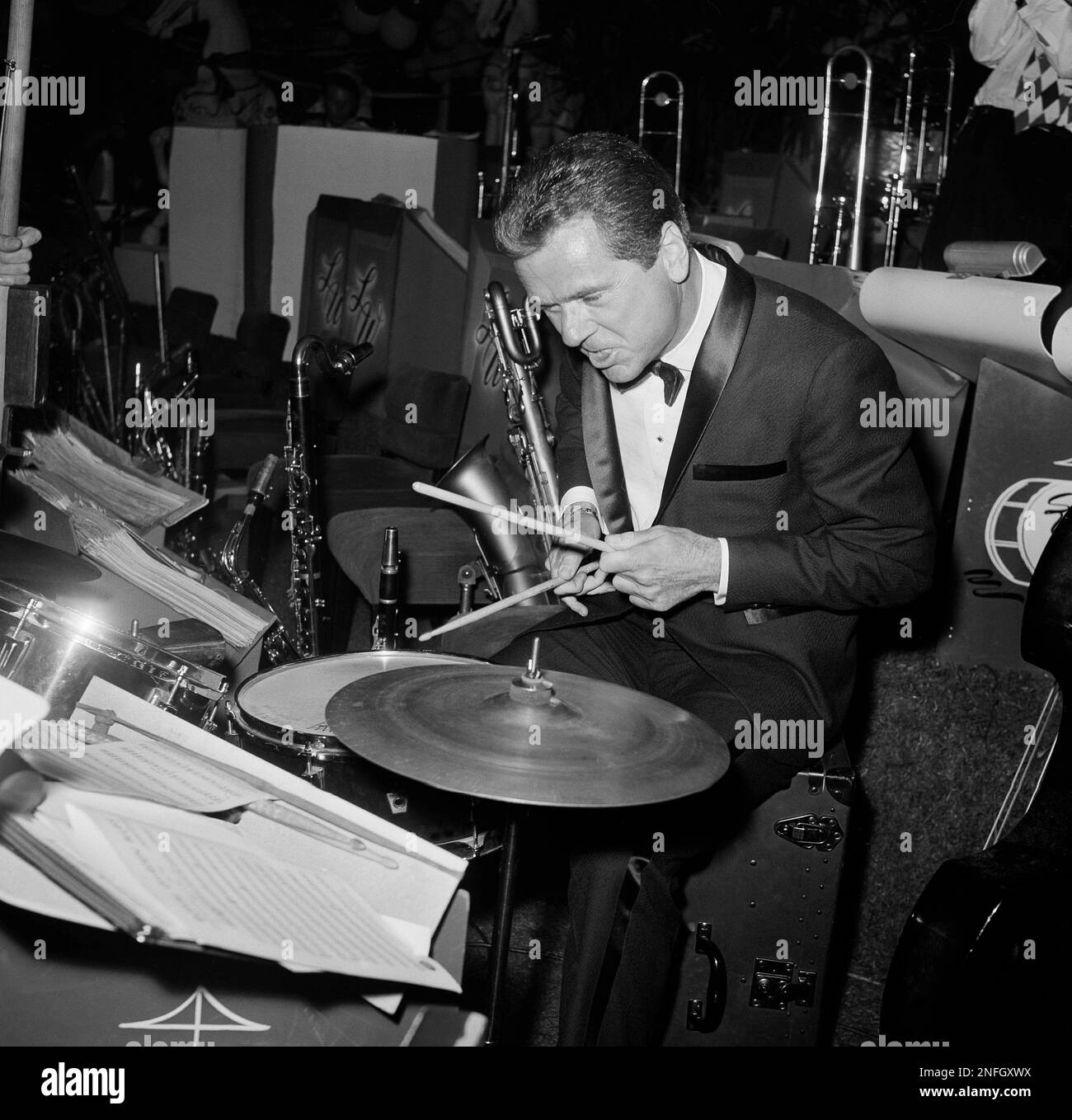 Jackie Cooper plays drums with the band at a party following the annual ...