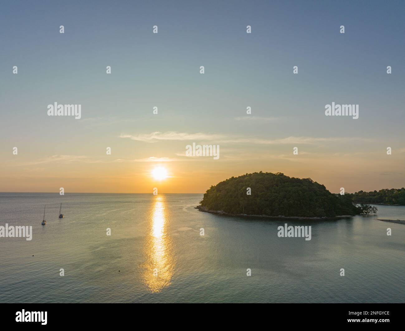 aerial view beautiful sunset above Kala island at Layan beach Phuket ...