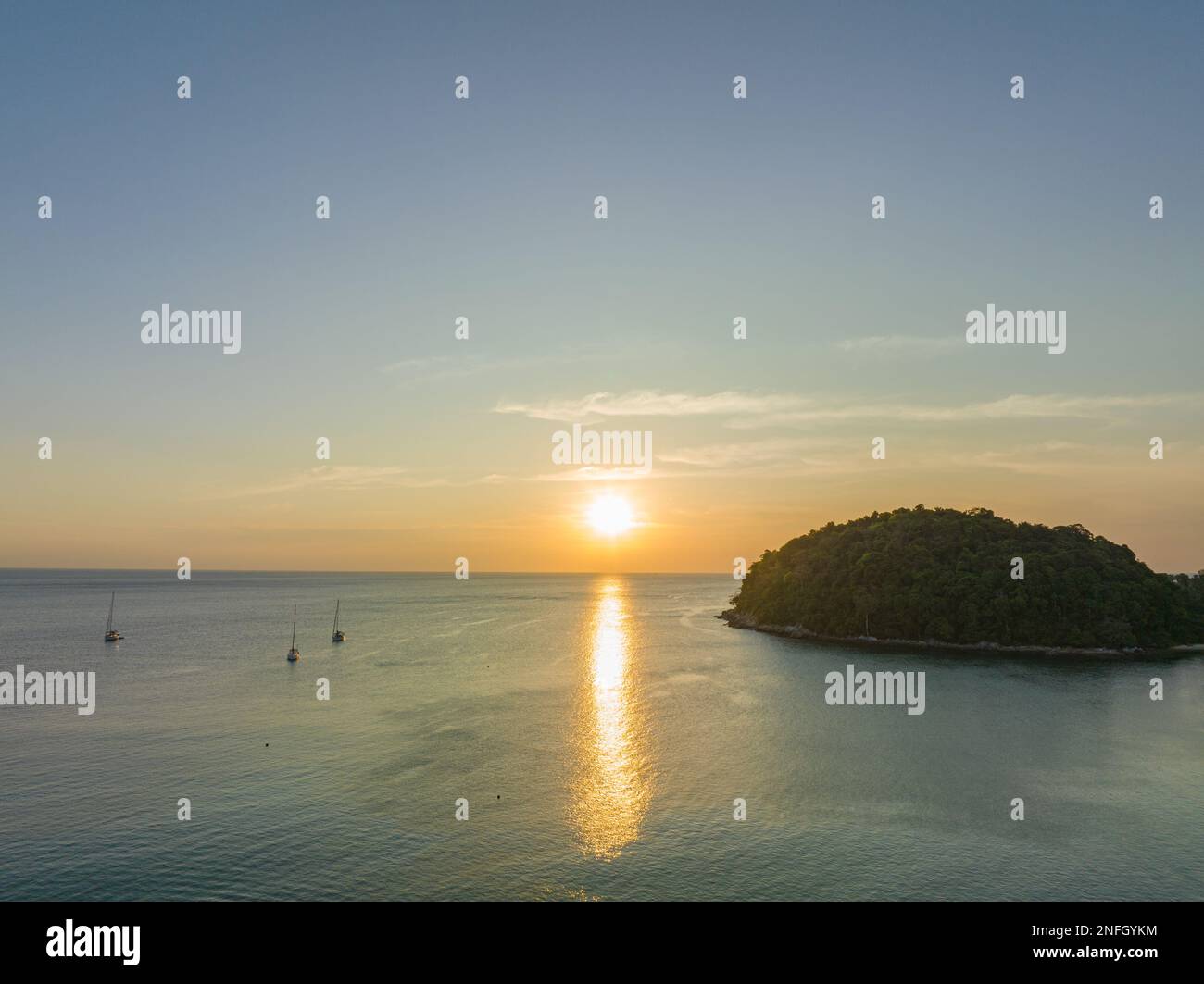 aerial view beautiful sunset above Kala island at Layan beach Phuket ...